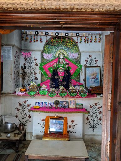 Deity of Vrinda Devi from a distance.