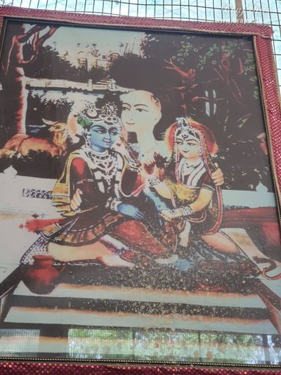 Painting of Shri Radha Krishn seated on the lap of Swami Haridas Ji at ...